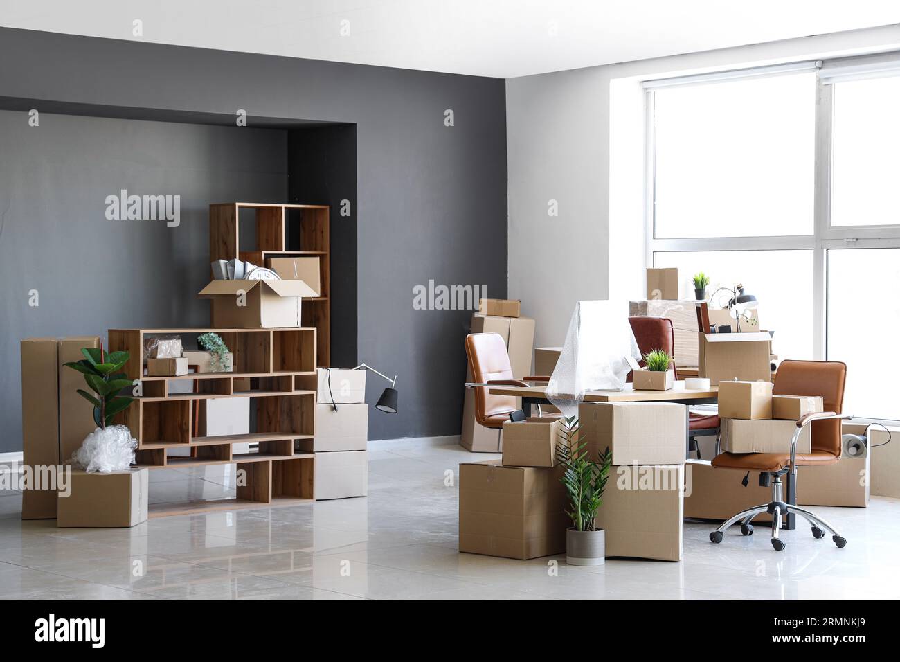 Interior of modern office with cardboard boxes on moving day Stock ...