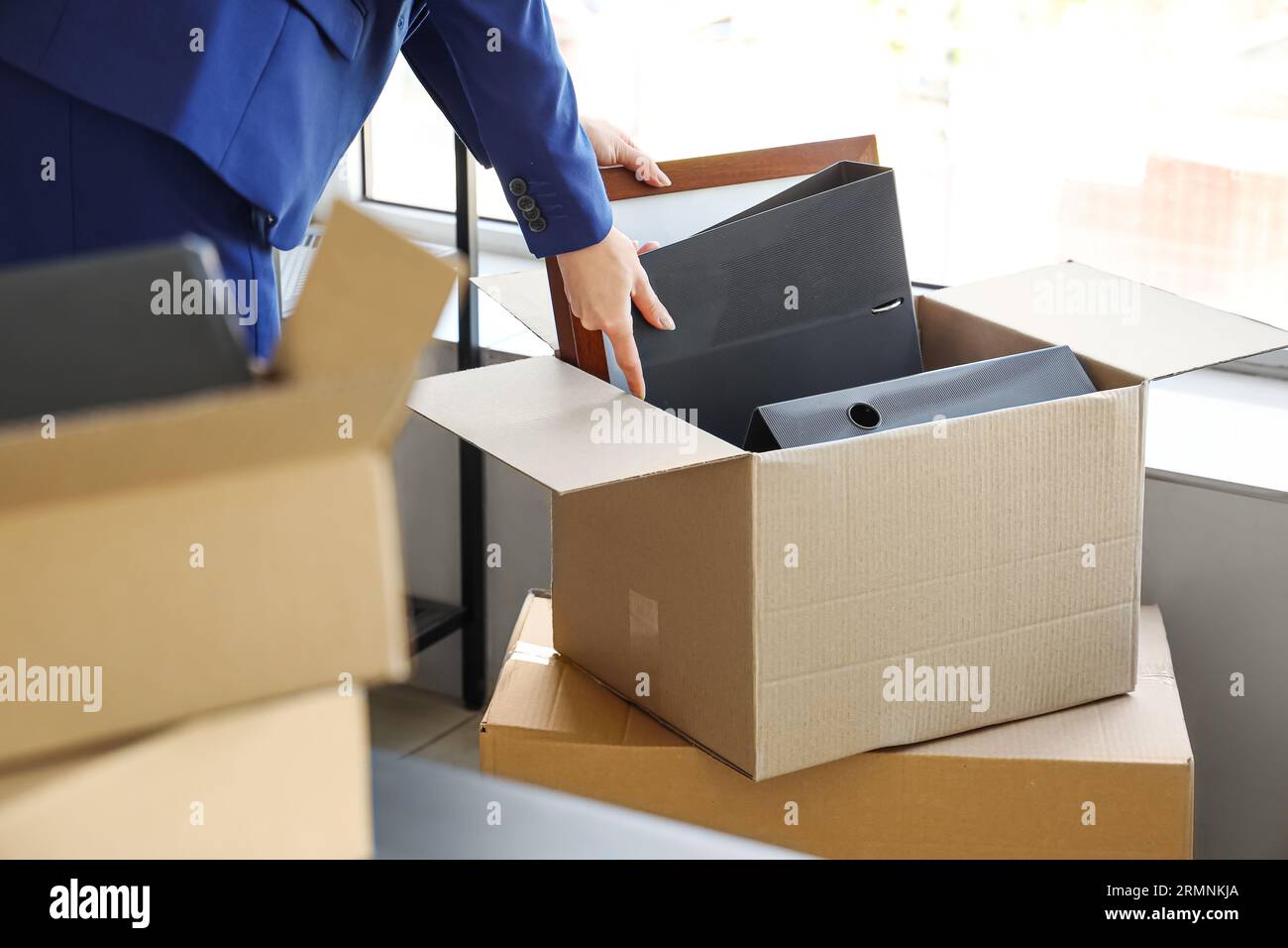 Businesswoman packing documents things box hi-res stock photography and ...