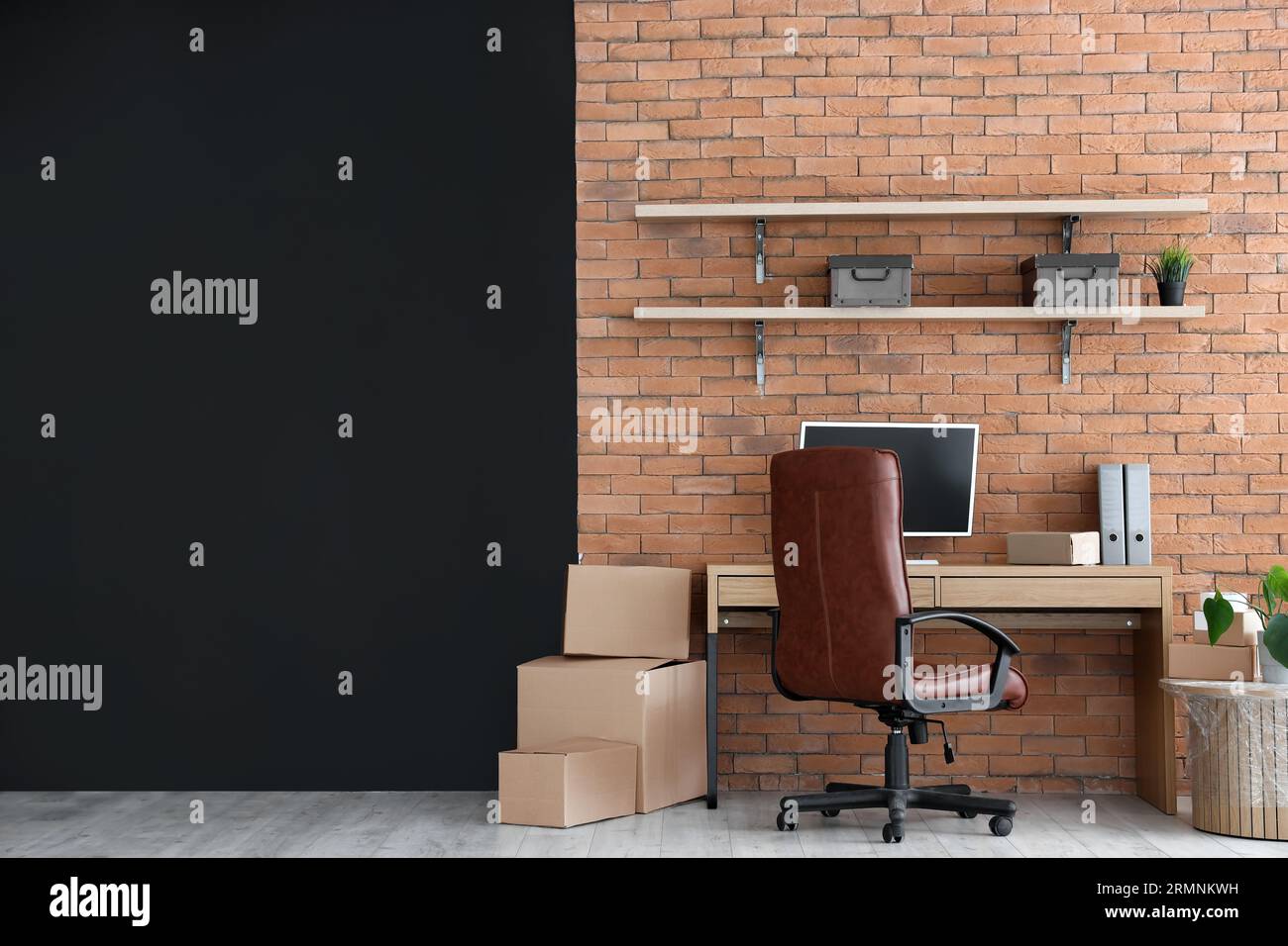 Interior of stylish office with cardboard boxes on moving day Stock ...