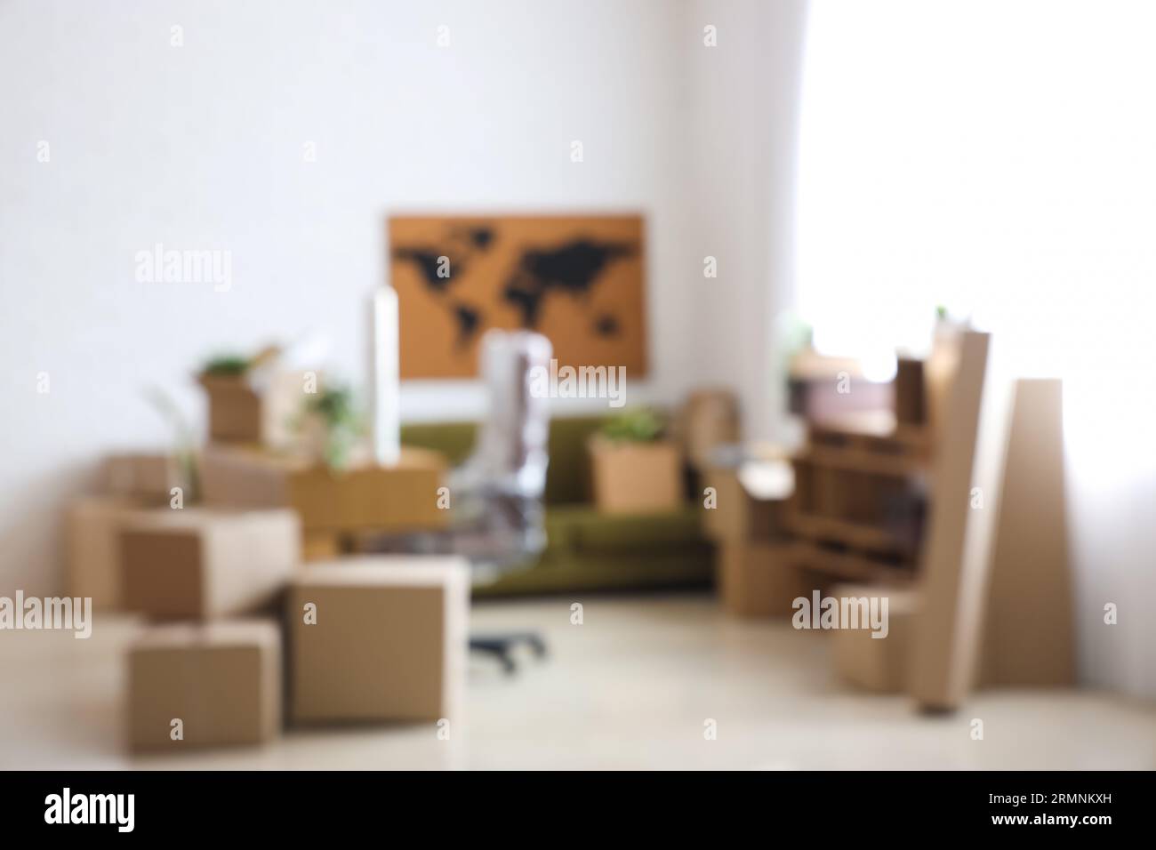 Blurred view of office with cardboard boxes on moving day Stock Photo ...