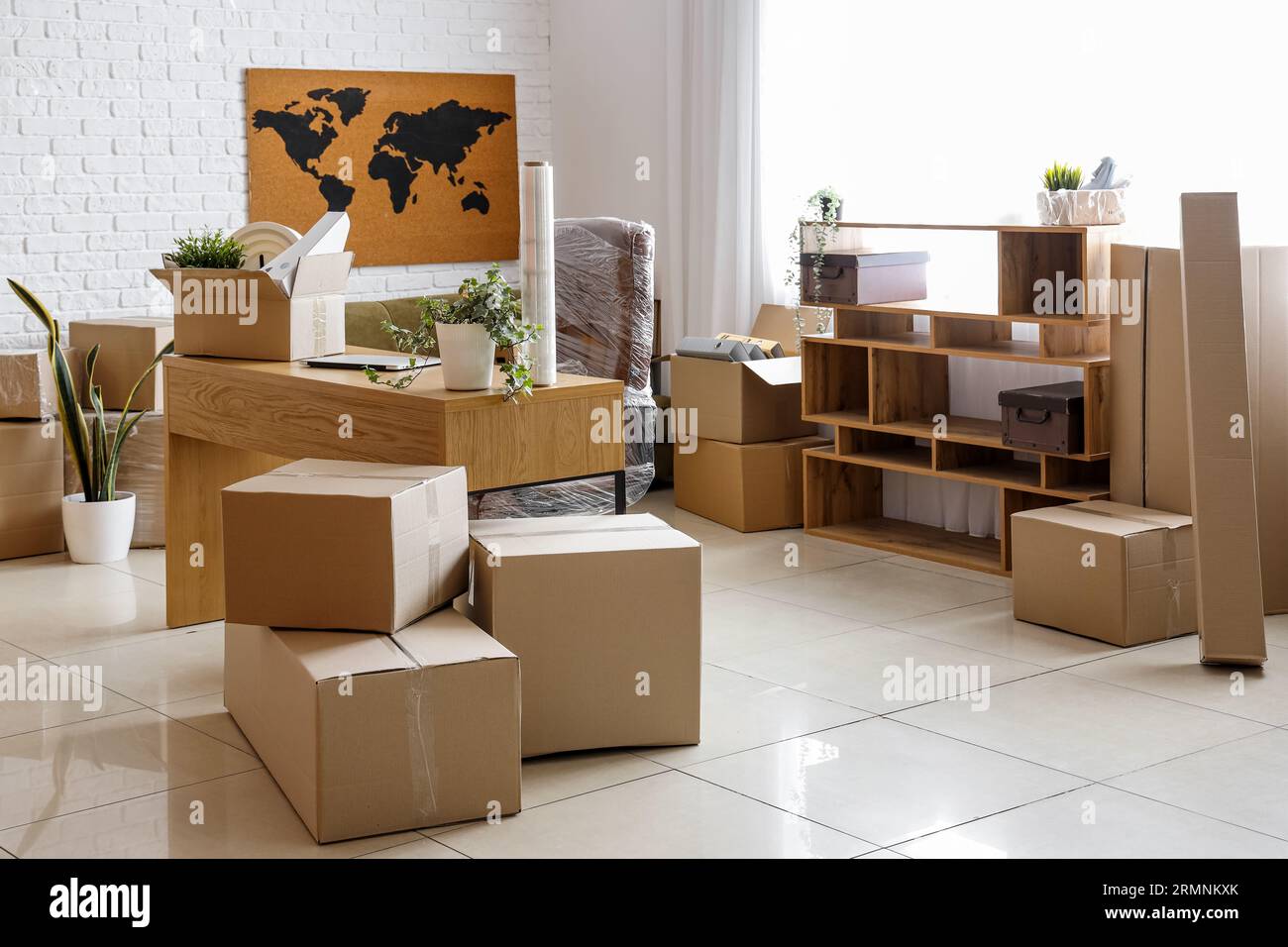 Modern workplace with cardboard boxes in office on moving day Stock ...