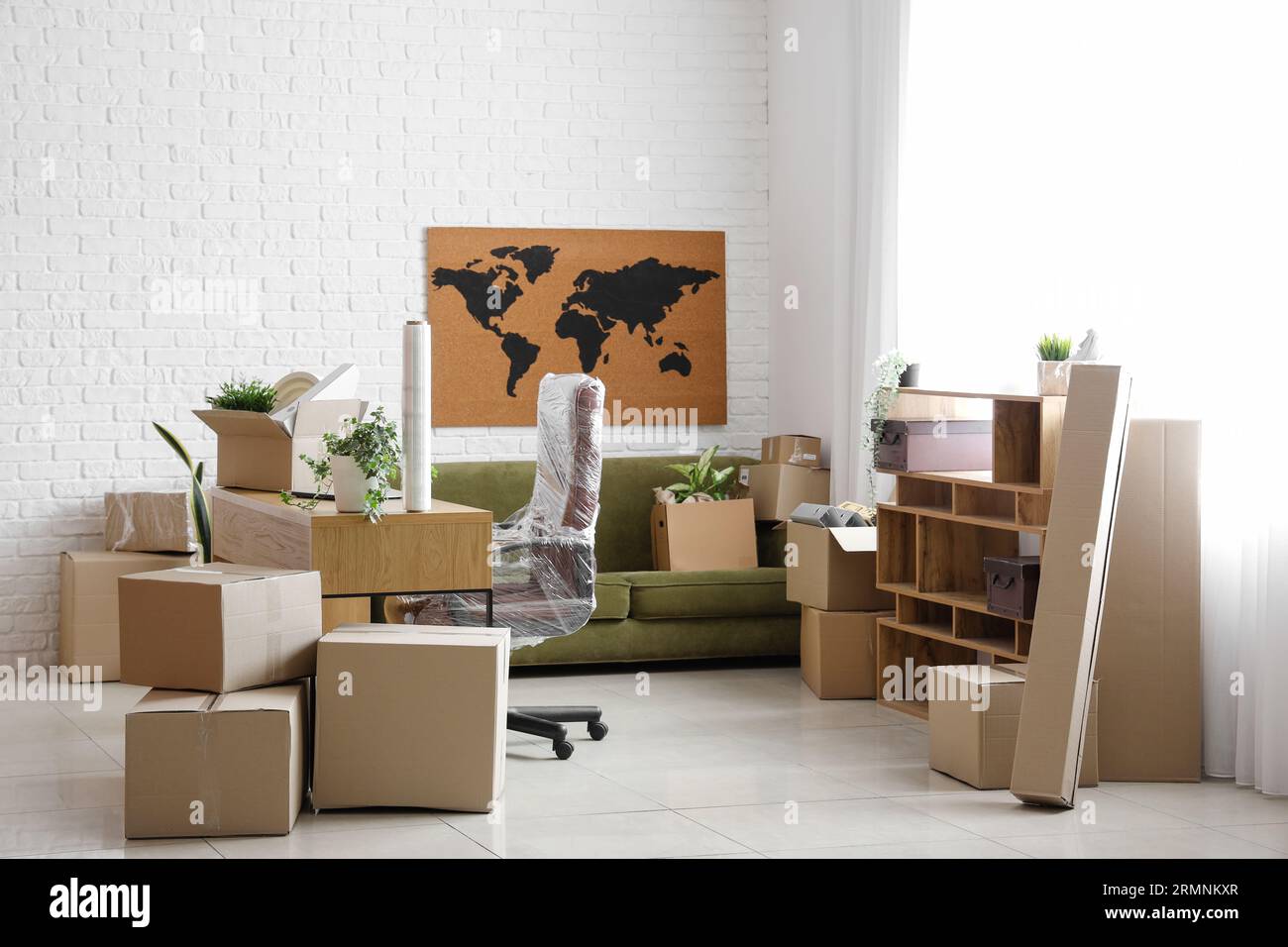 Modern workplace with cardboard boxes in office on moving day Stock ...