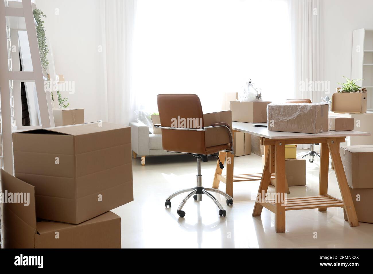 Modern workplace with cardboard boxes in office on moving day Stock ...