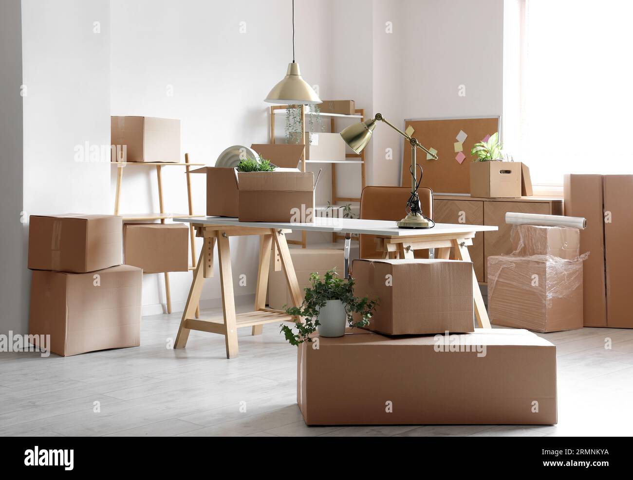 Modern workplace with cardboard boxes in office on moving day Stock ...