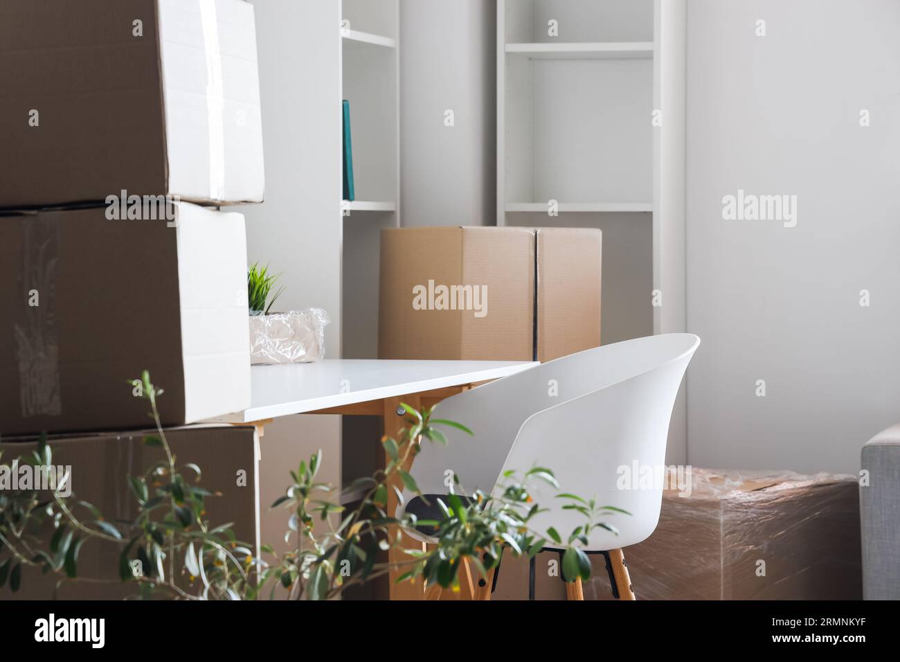 Modern workplace with cardboard boxes in office on moving day Stock ...