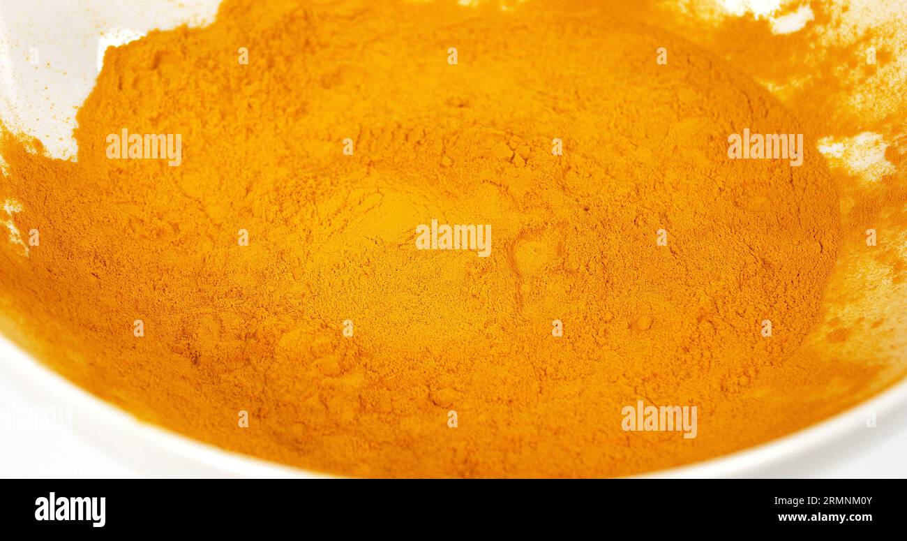 Turmeric, curcuma longa, Powder falling against White Background ...