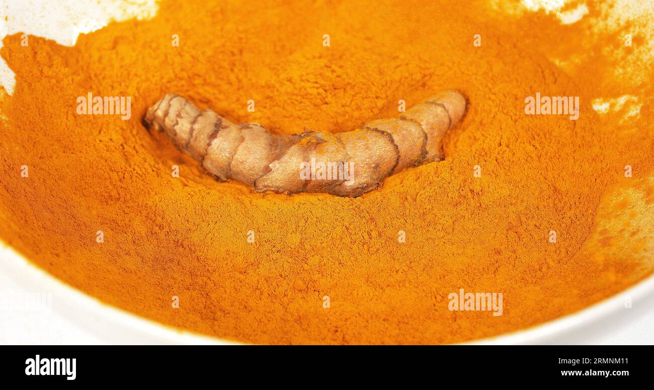 Turmeric, curcuma longa, Root falling on curcuma Powder, Indian Spice ...