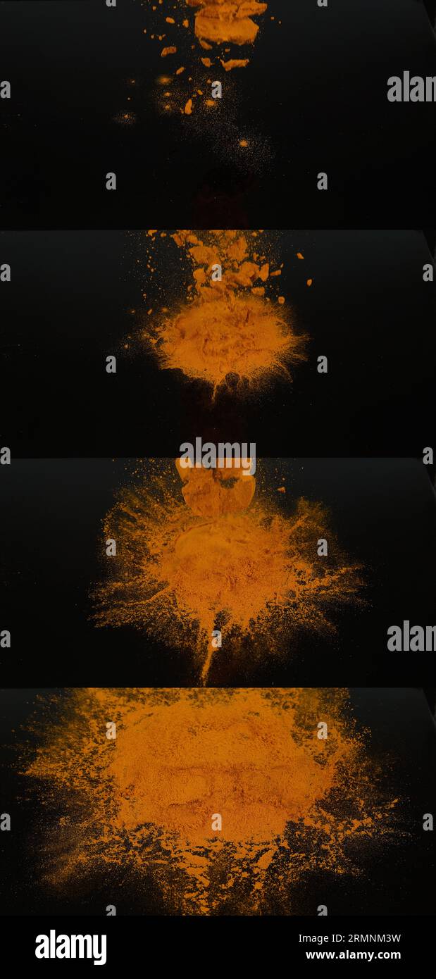 Turmeric, curcuma longa, Powder falling against Black Background ...