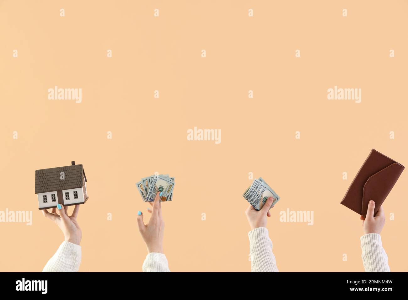 Women with house model, money and wallet on beige background Stock ...
