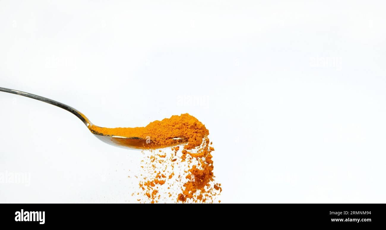 Turmeric, curcuma longa, curcuma Powder falling on Spoon, Indian Spice ...