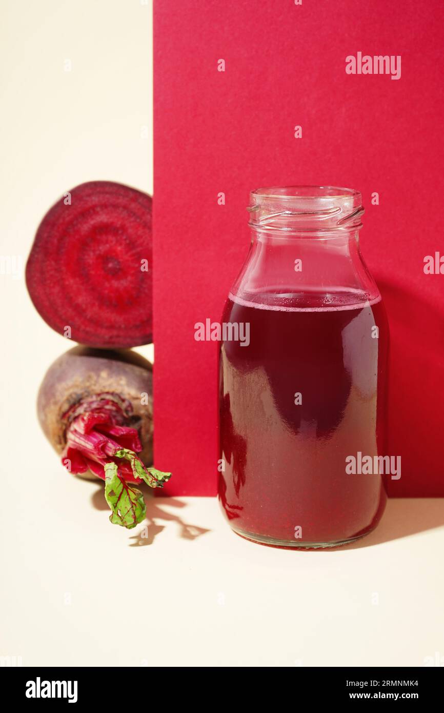 Bottle of healthy beet juice on colorful background Stock Photo - Alamy