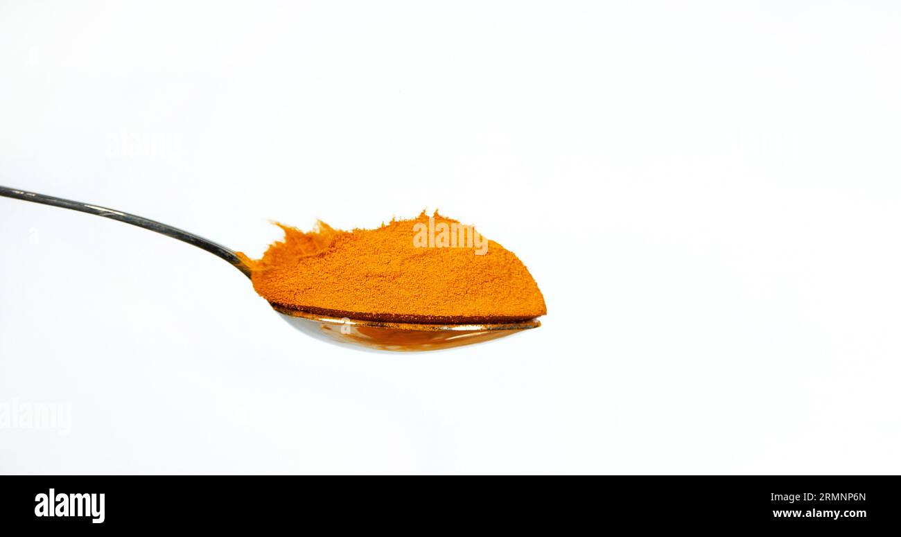 Turmeric, curcuma longa, curcuma Powder falling on Spoon, Indian Spice ...