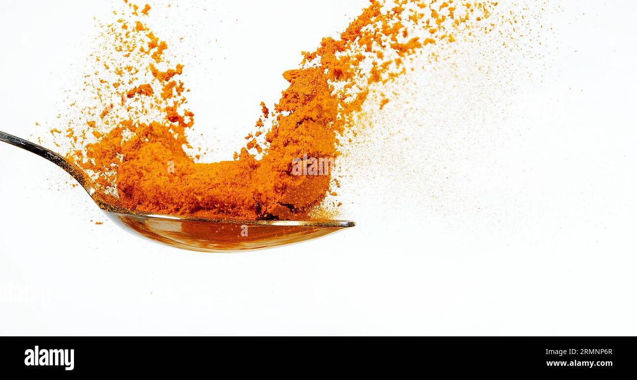 Turmeric, curcuma longa, curcuma Powder falling on Spoon, Indian Spice ...