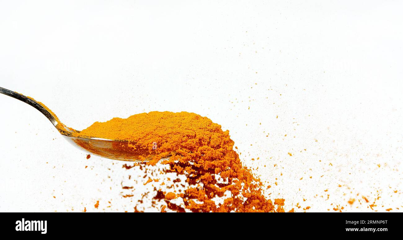 Turmeric, curcuma longa, curcuma Powder falling on Spoon, Indian Spice ...