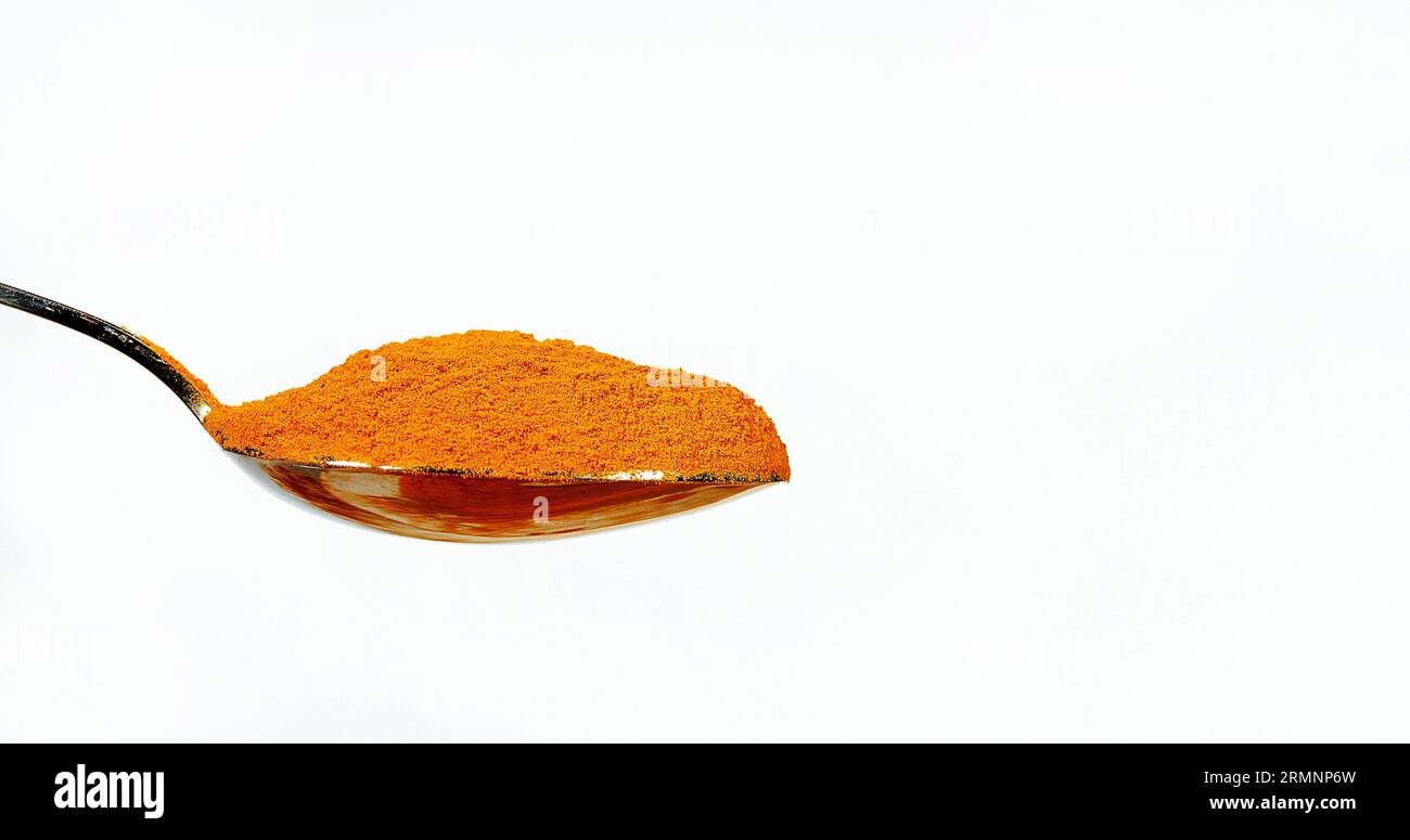 Turmeric, curcuma longa, curcuma Powder falling on Spoon, Indian Spice ...