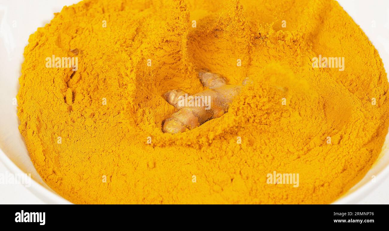 Turmeric, curcuma longa, Root falling on curcuma Powder, Indian Spice ...