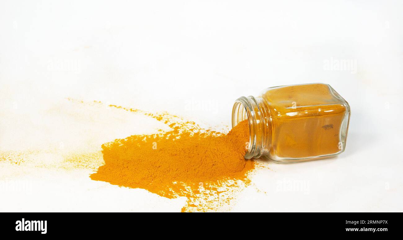 Turmeric, curcuma longa, Powder in a small Jar against White Background ...