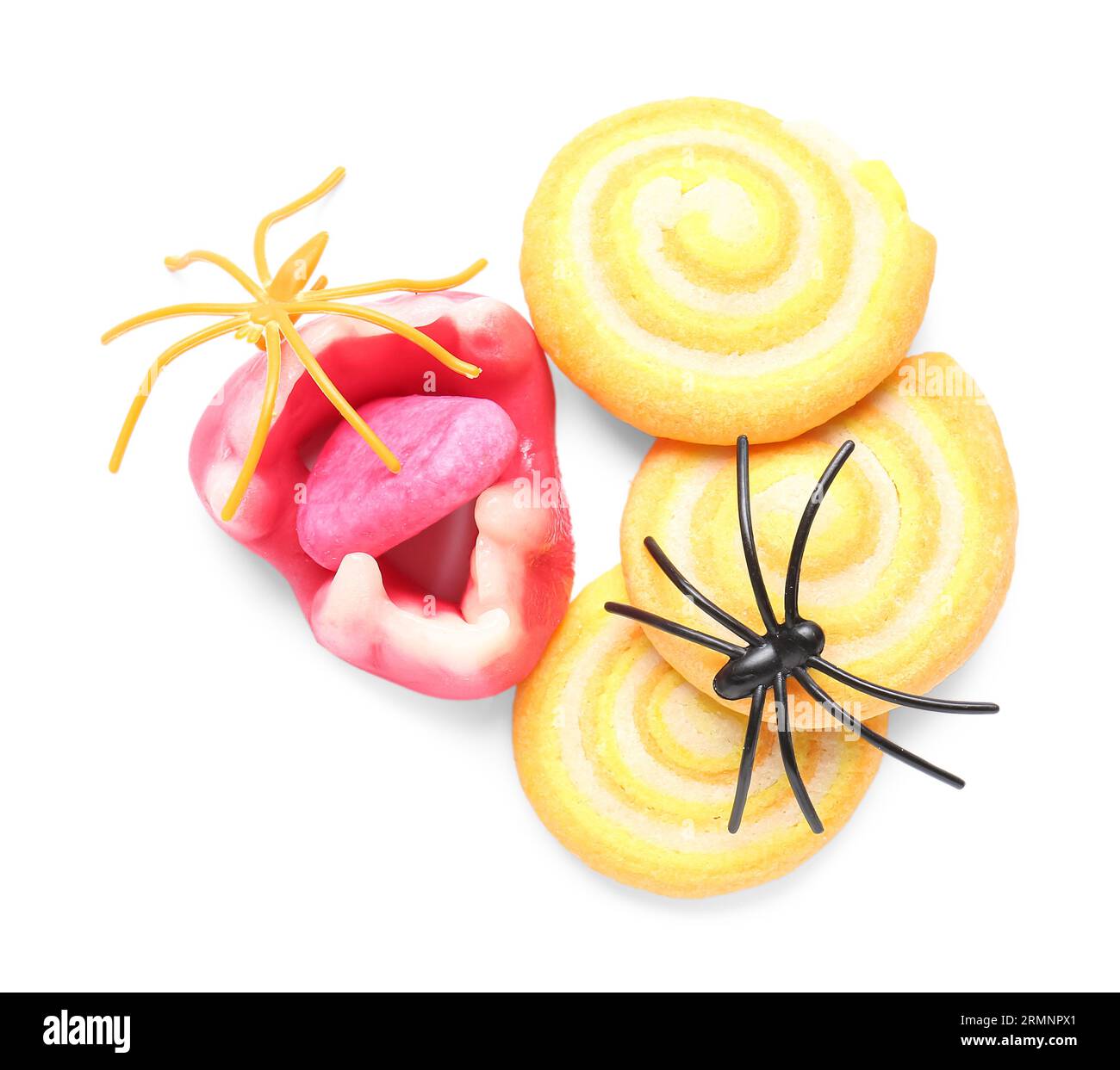 Tasty cookies with scary candy for Halloween celebration isolated on ...