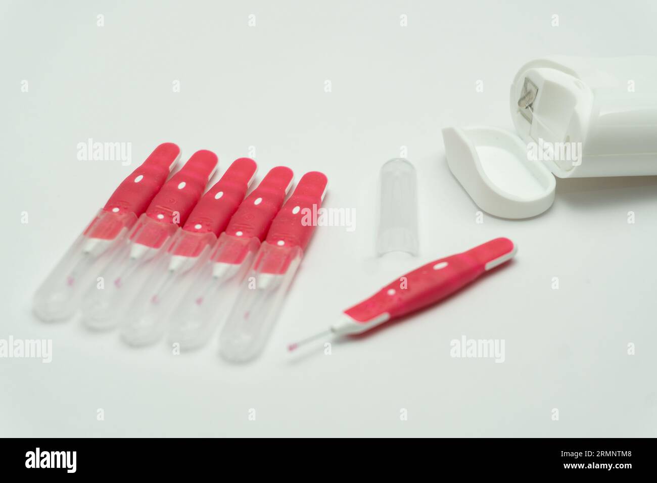 Interdental brush sticks and dental floss on white background, copy ...