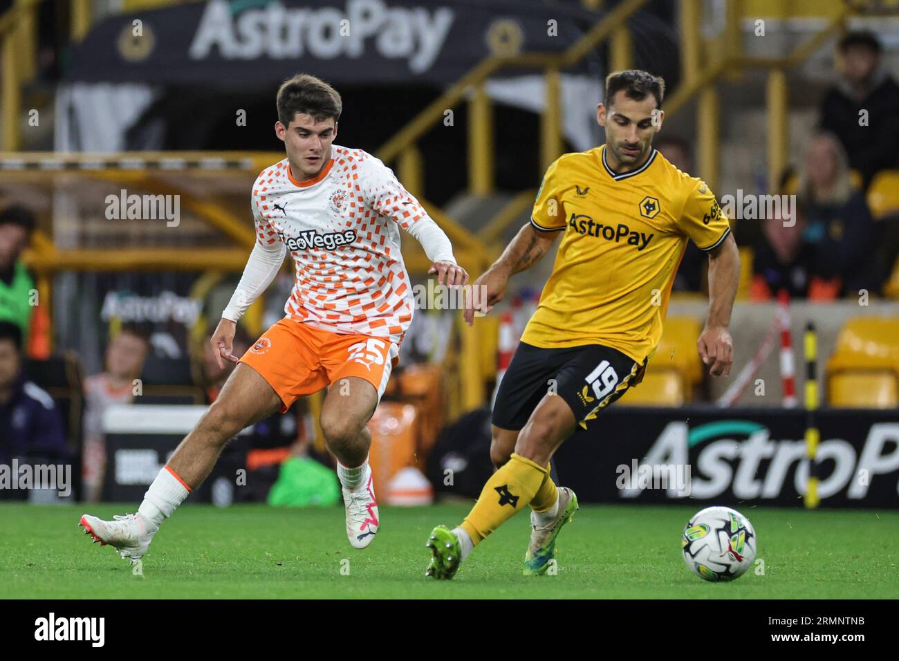 Rob Apter #25 of Blackpool tracks Jonny #19 of Wolverhampton Wanderers ...