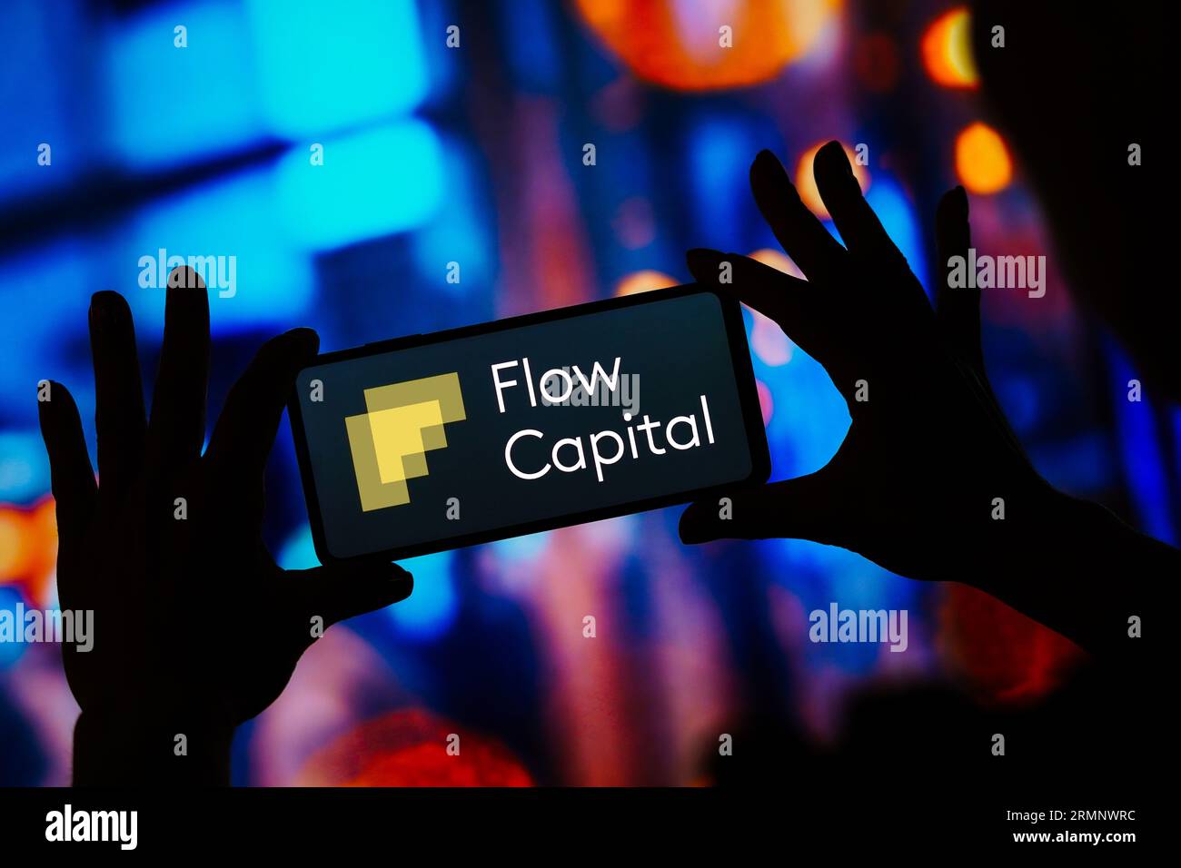 In this photo illustration, the Flow Capital logo seen displayed on a ...