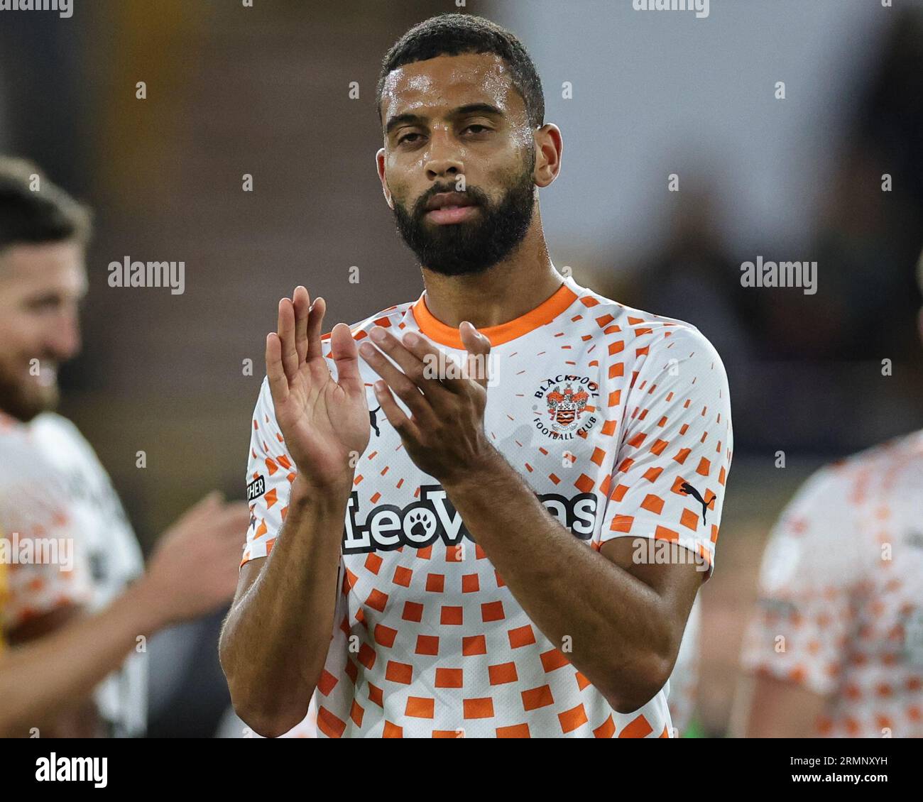 CJ Hamilton #22 of Blackpool applauds the travelling fans during the ...