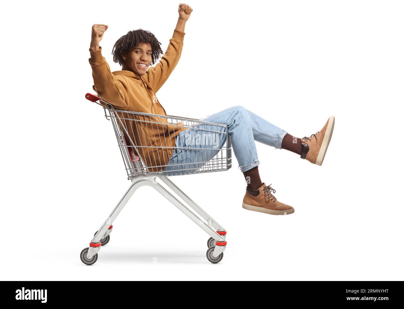 Happy african american young man sitting inside a shopping cart ...