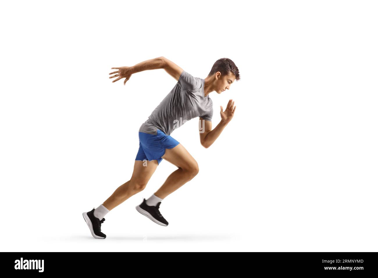 Full length profile shot of a fit young man running fast isolated on white background Stock ...