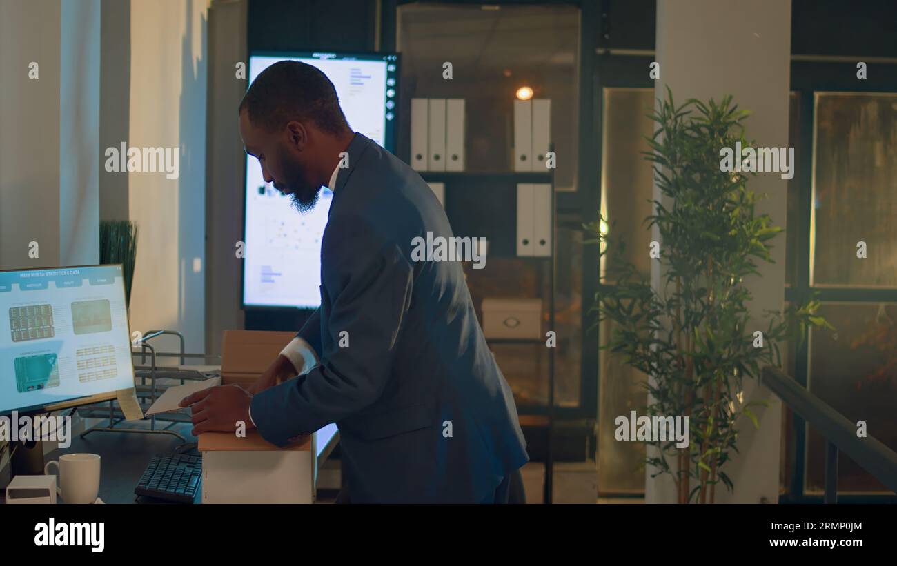 Sad businessman getting consoled by colleague during last office ...