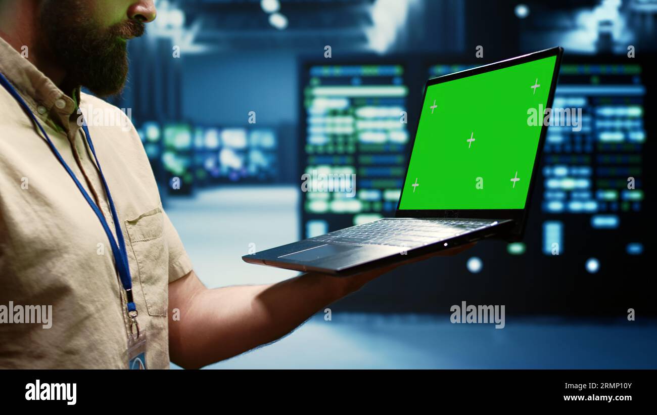 Specialist Using Green Screen Laptop To Check Server Clusters Configuration Settings Close Up