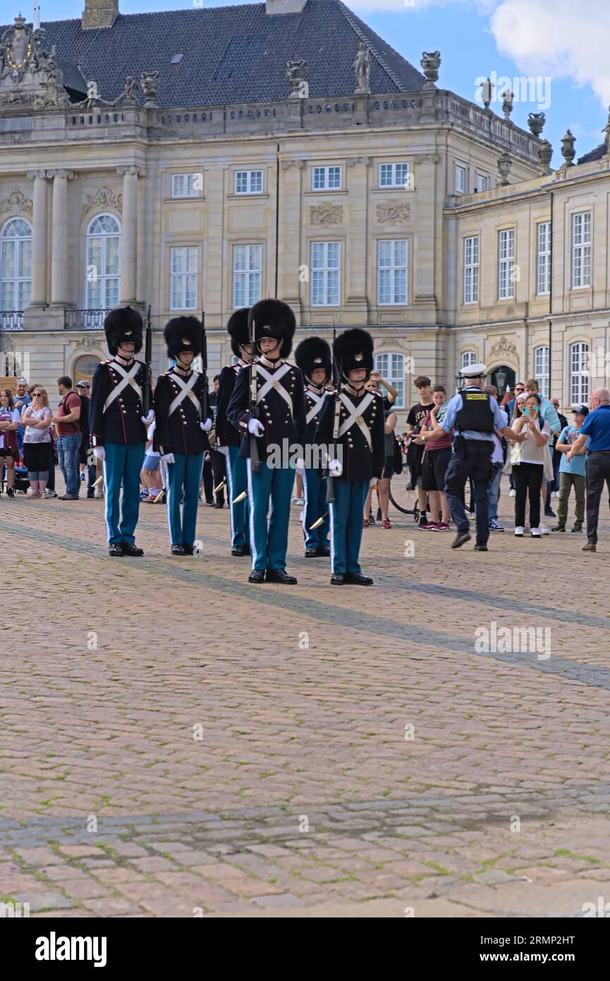 Unit of the Royal Life Guards stand still at attention and relieve the outgoing guard at the ...