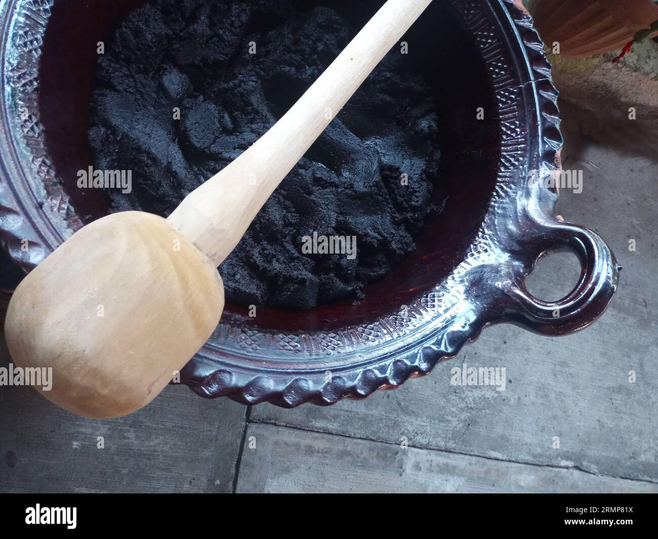 Preparation of Mexican Mole Rojo dish made with chili peppers, spices ...