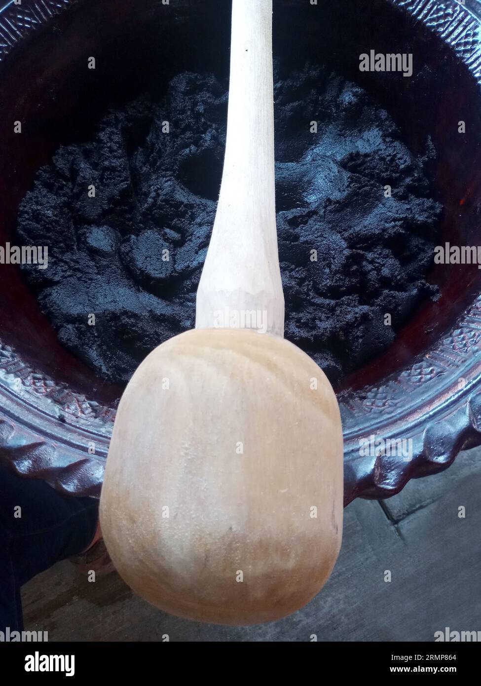 Preparation of Mexican Mole Rojo dish made with chili peppers, spices ...