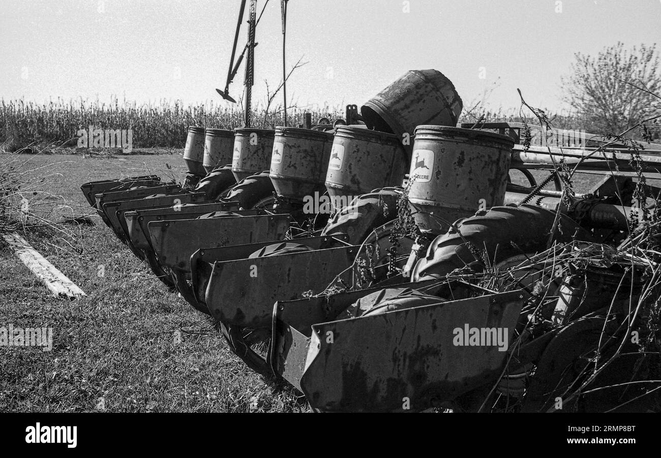 Black and white side view of outdated corn planter Stock Photo - Alamy