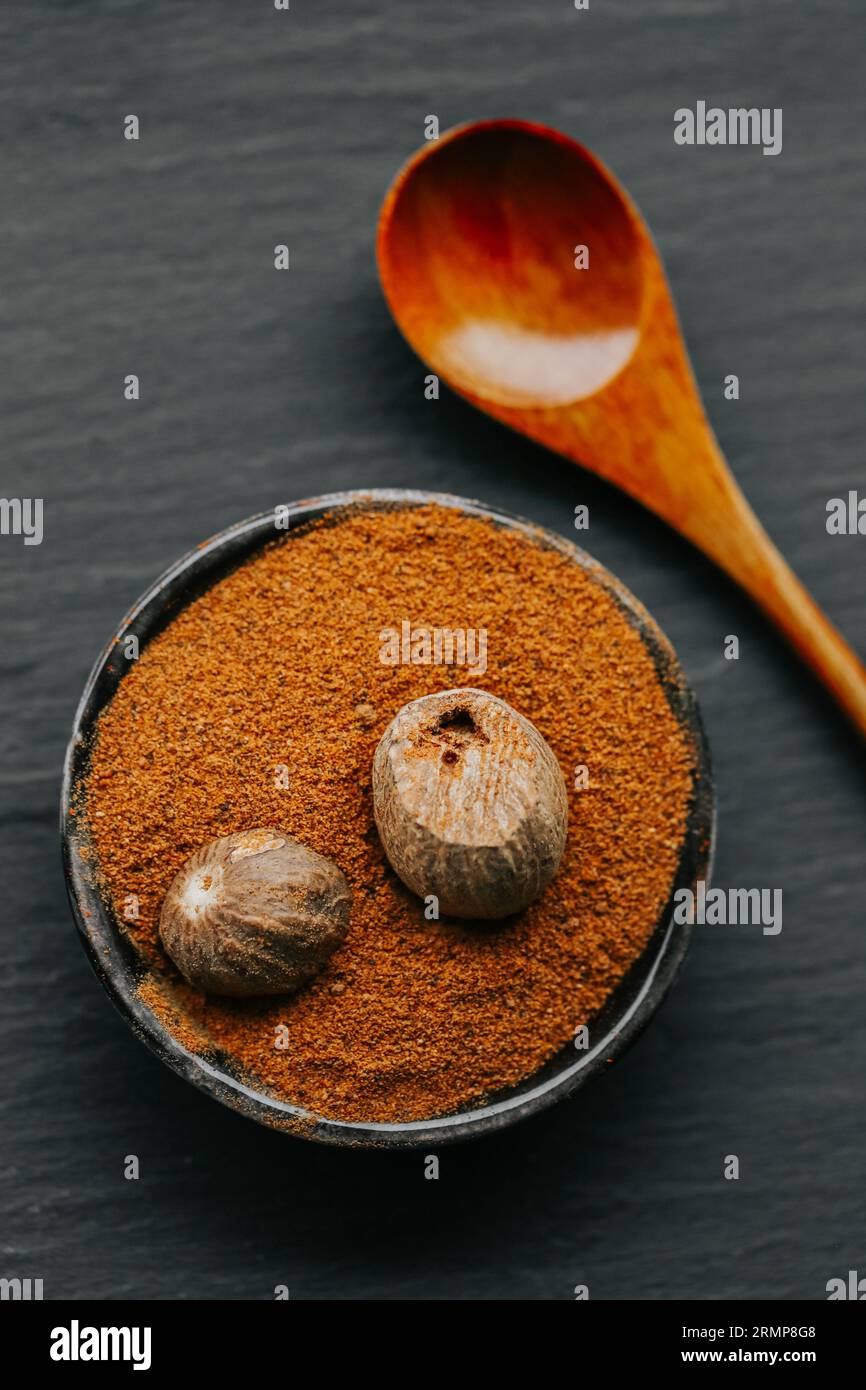 Nutmeg whole and ground.condiments and spices background.Nutmeg in a ...
