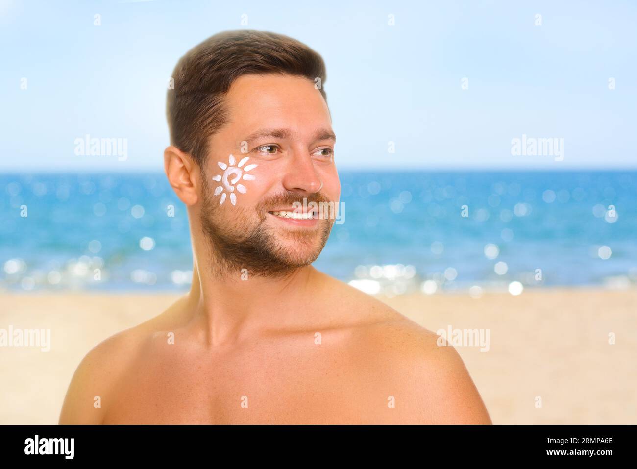 Sun protection. Man with sunblock on his face near sea Stock Photo - Alamy