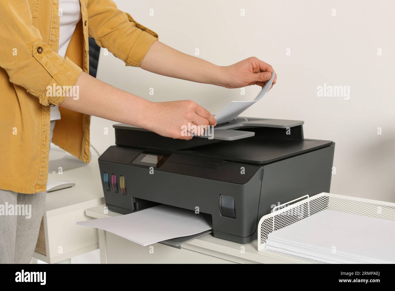 Woman using modern printer at home, closeup Stock Photo - Alamy
