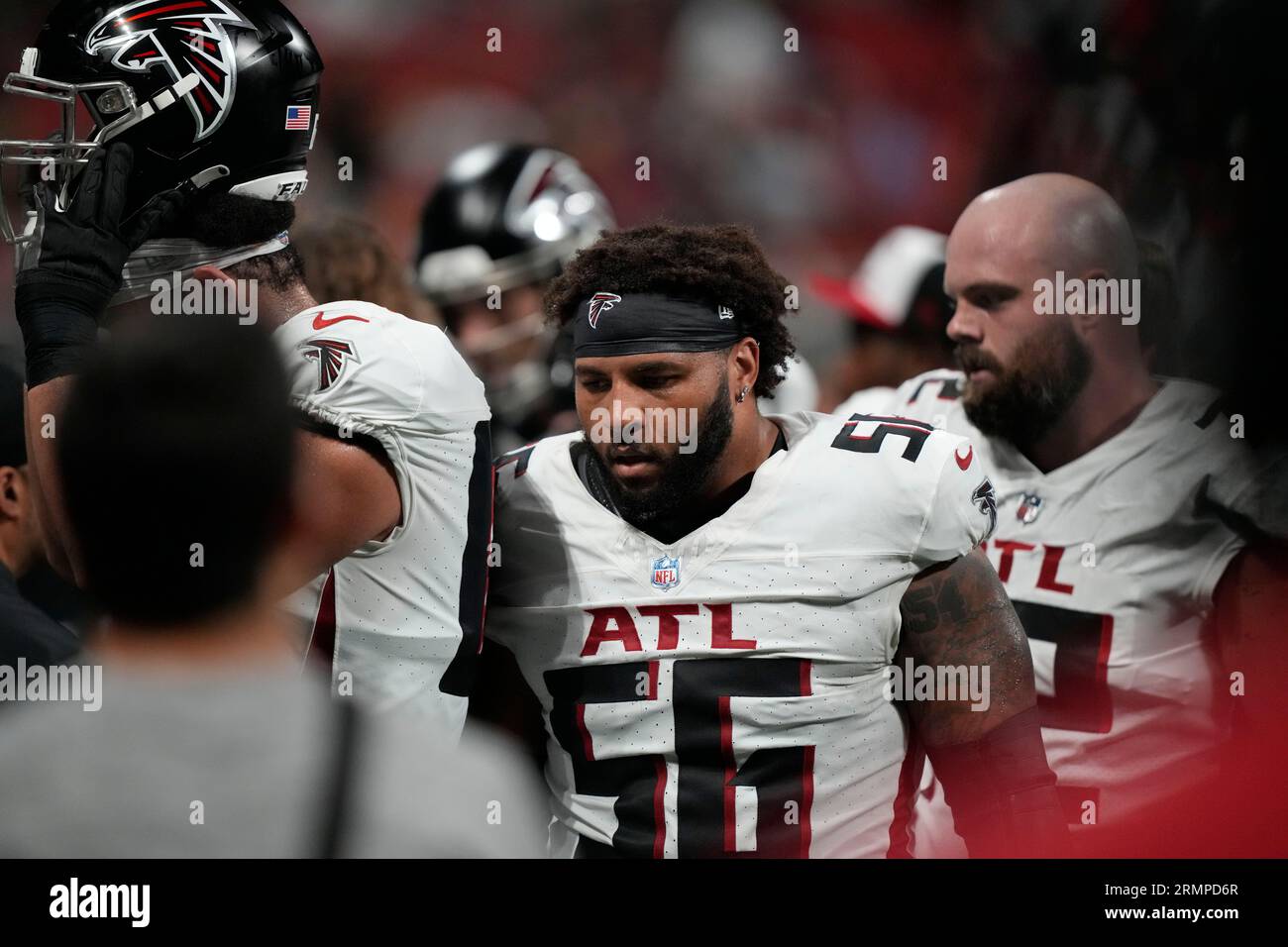 Atlanta Falcons guard Jovaughn Gwyn (56) walks on the sideline in the ...