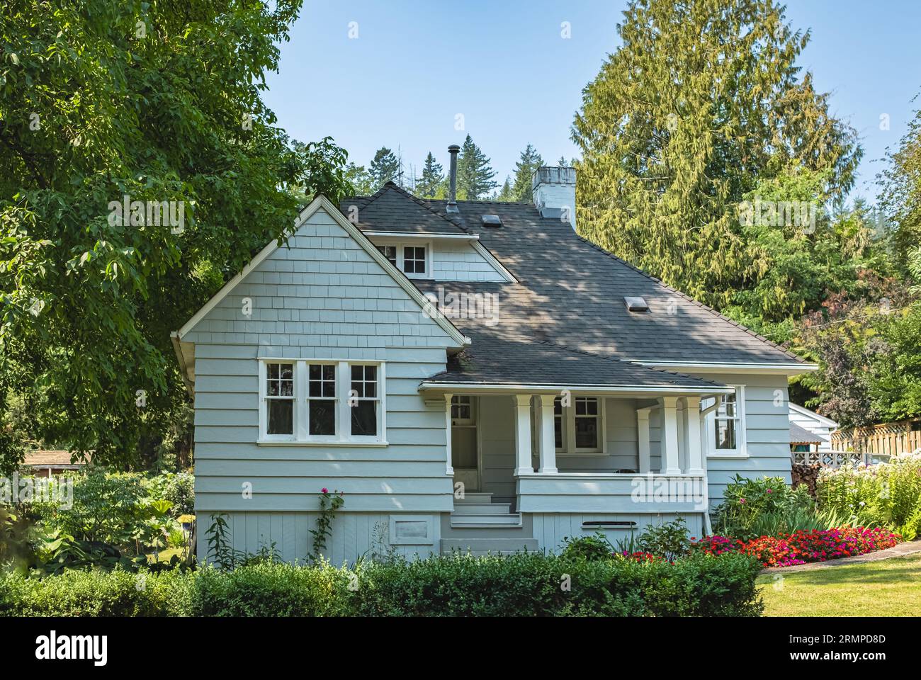 Typical wooden country house with lawn. Small wooden house in rural ...