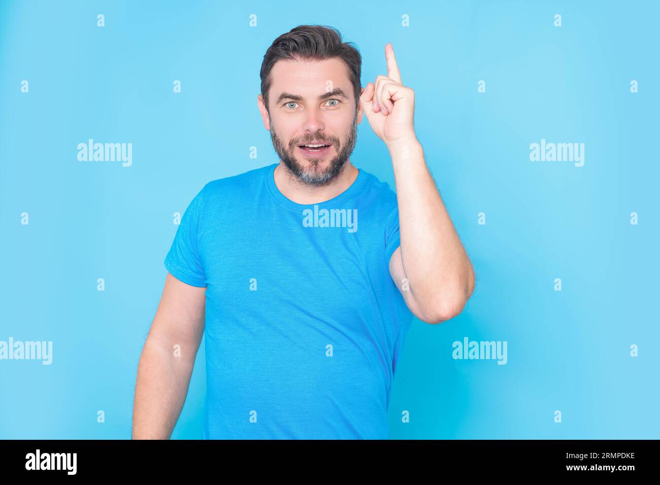 Hispanic man point up thinking of idea, pointing up. Portrait of man ...