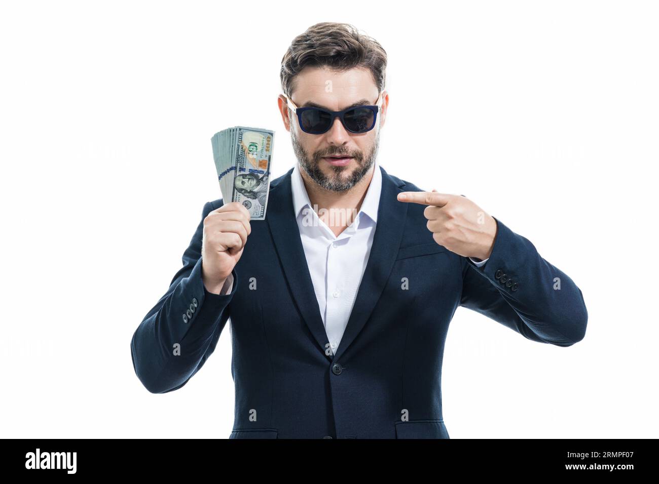 Good payment. Handsome business man holding money isolated over grey ...