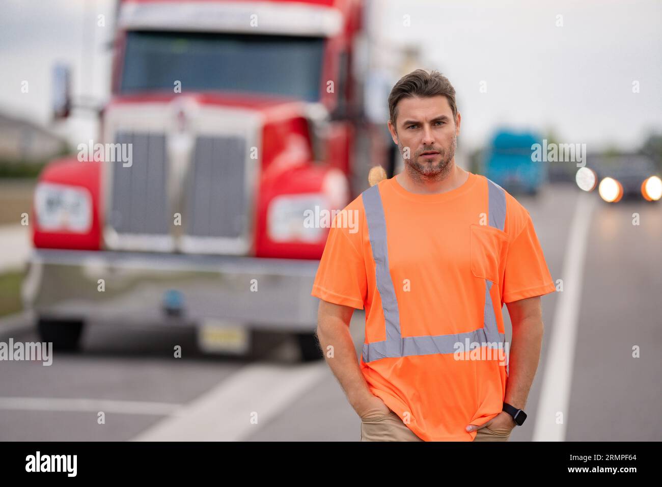 Men driver near lorry truck. Man owner truck driver in safety vest near ...