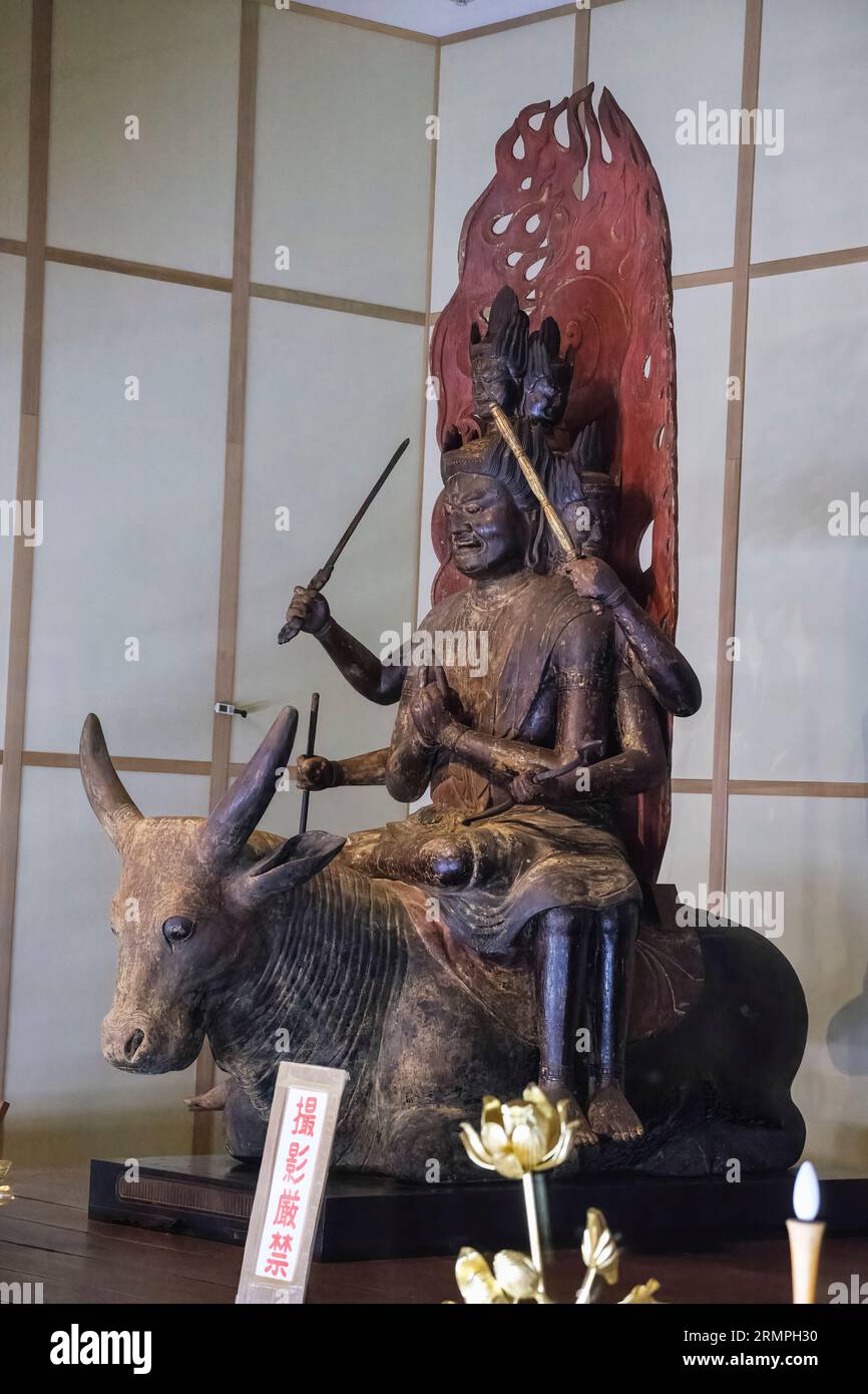 Japan, Kyushu. Makiodo Temple, Daiitoku-Myo-o riding a white water ...