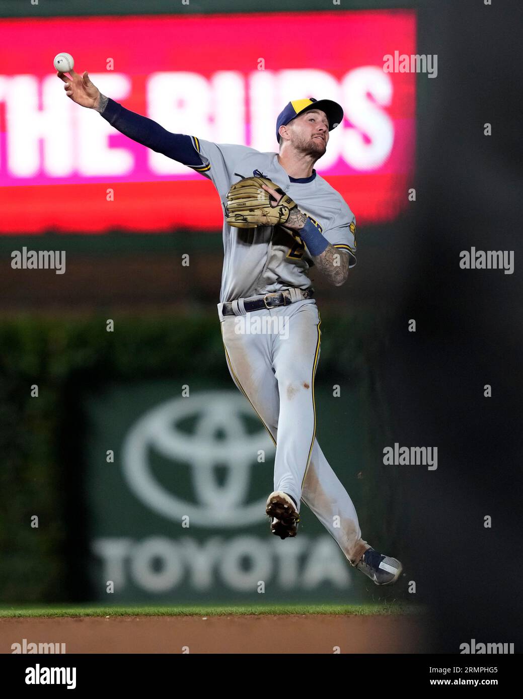 Milwaukee Brewers second baseman Brice Turang throws to first after ...