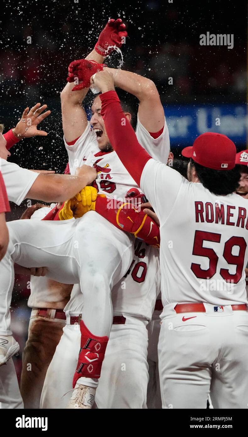 St. Louis Cardinals' Tommy Edman is congratulated by teammates after ...