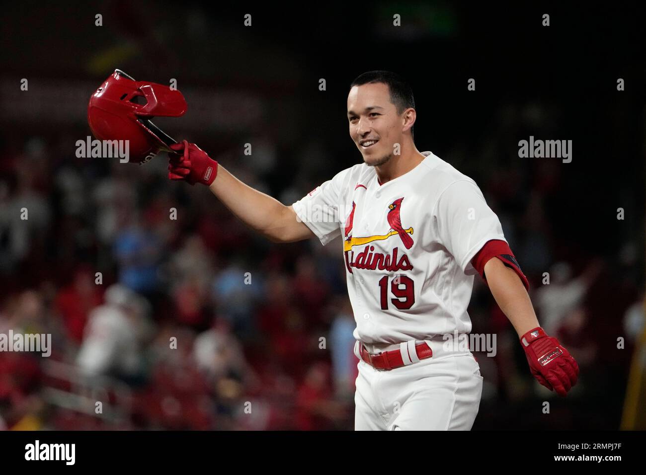 St. Louis Cardinals' Tommy Edman tosses his helmet after hitting a walk ...