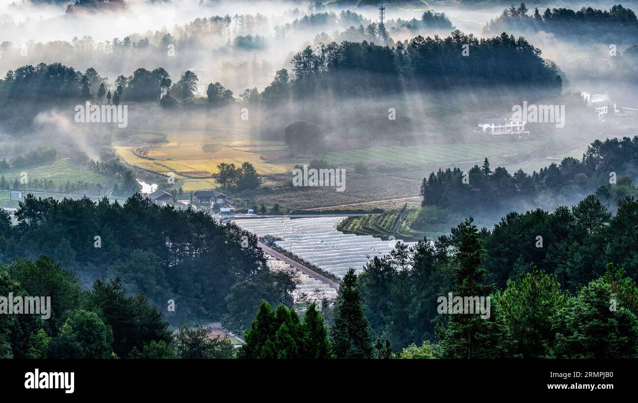 CHONGQING, CHINA - AUGUST 29, 2023 - The sun shines through the clouds ...