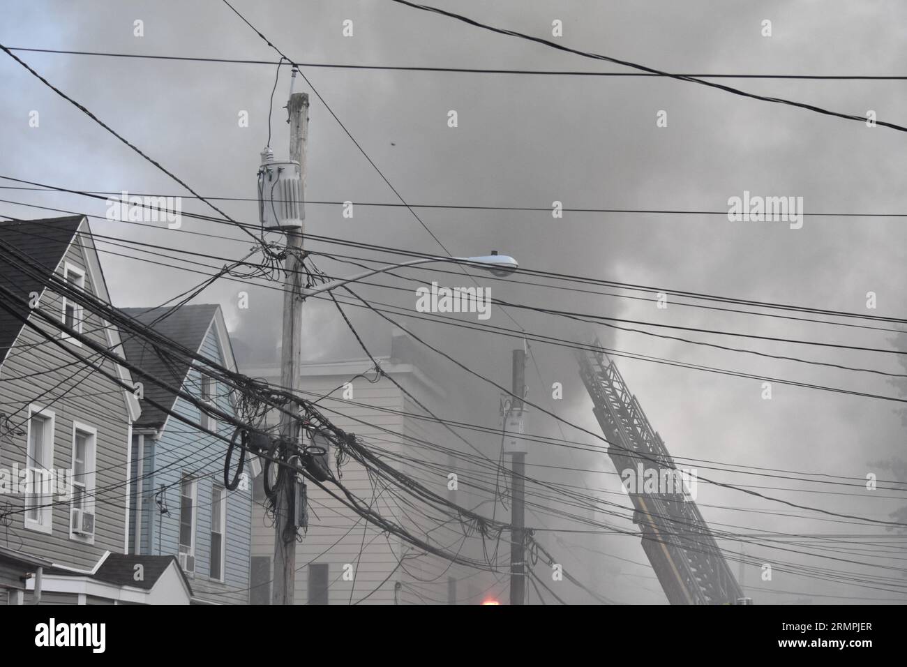 Newark, United States. 29th Aug, 2023. Flames shoot out of the roof of ...