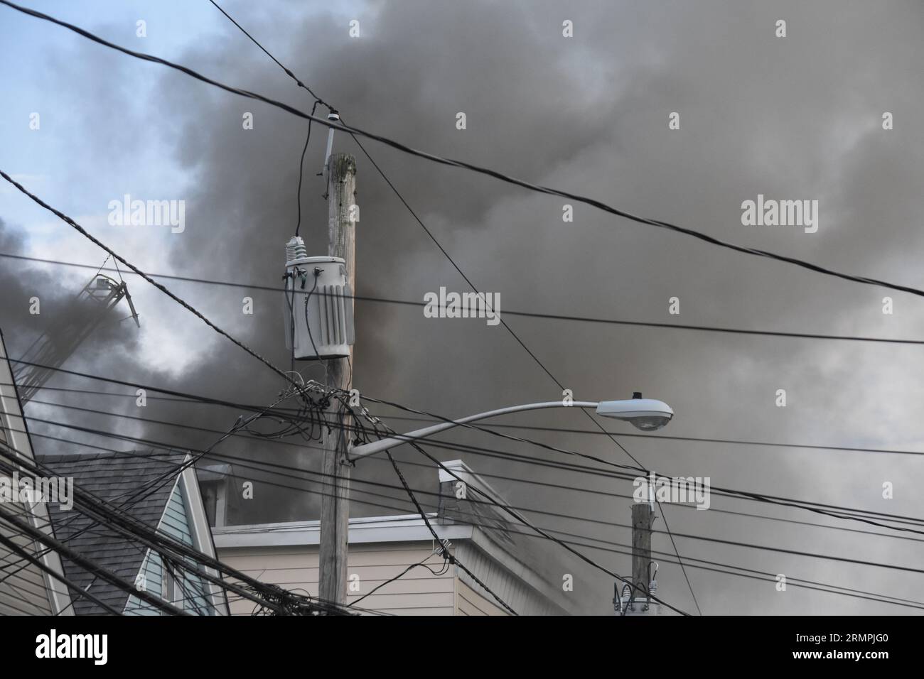 Newark, United States. 29th Aug, 2023. Flames shoot out of the roof of ...