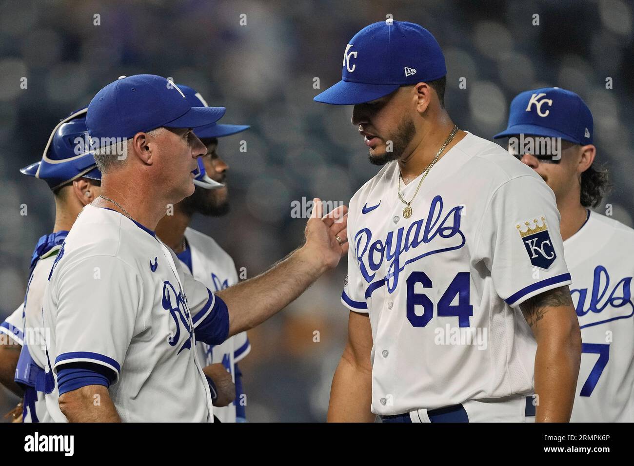 Kansas City Royals manager Matt Quatraro, left, talks to relief pitcher ...